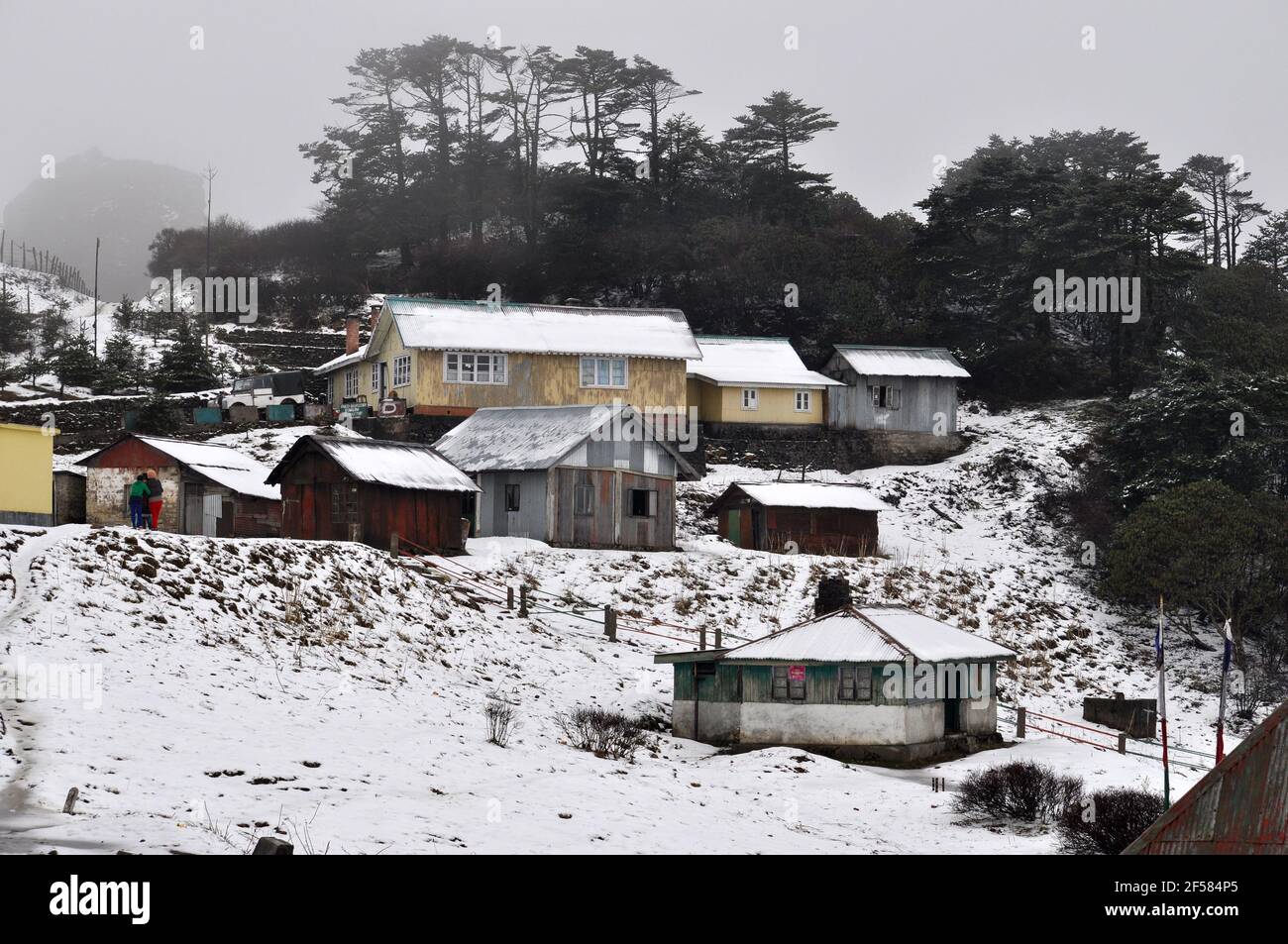 Cluster of home stay cottage covered with snow in remote village ...
