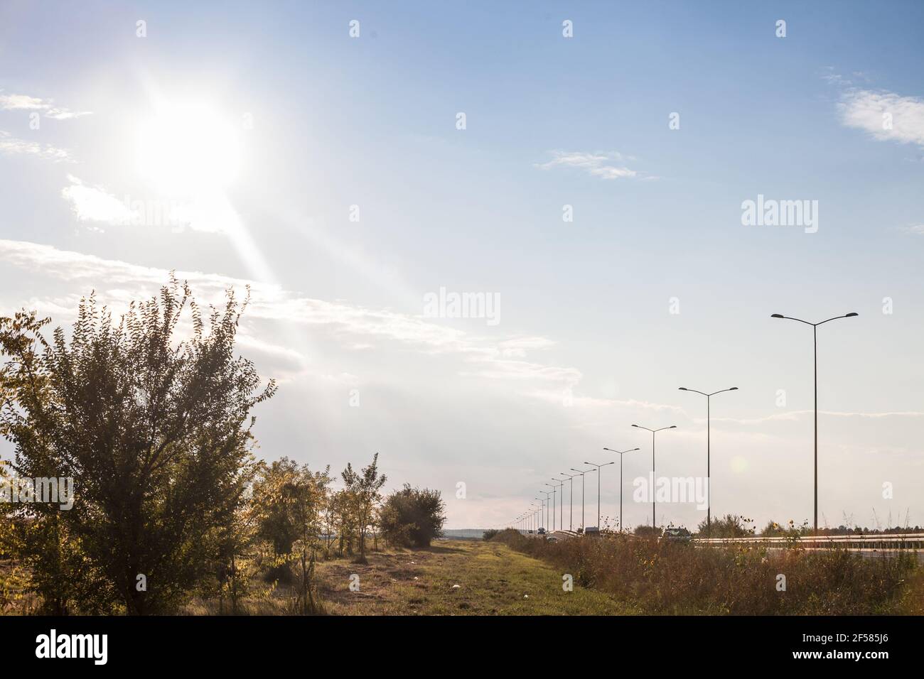 Rural landscape with a newly built freeway motorway road with traffic ...