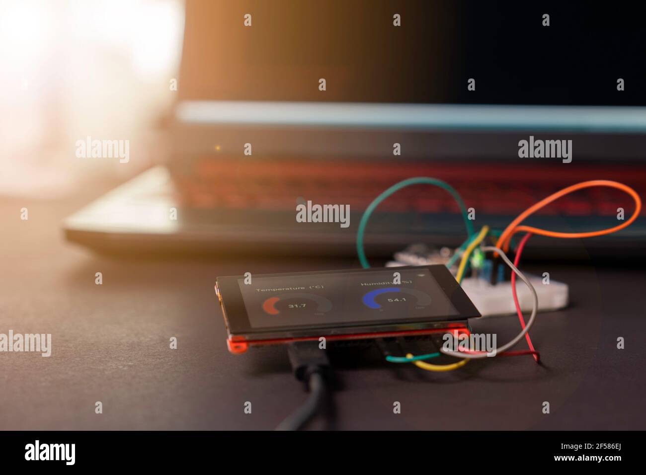 Using notebook computer to upload program to the microcontroller with ...