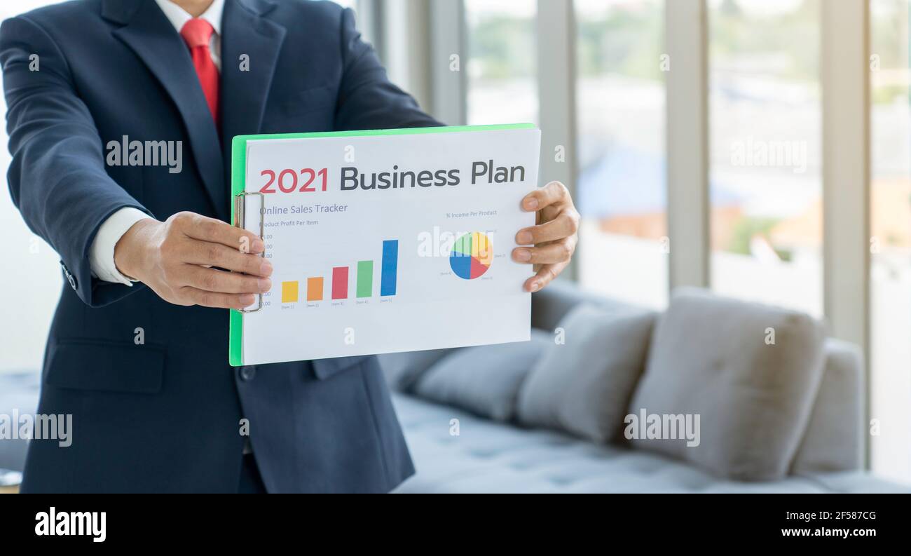 Businessman showing calendar hi-res stock photography and images - Alamy