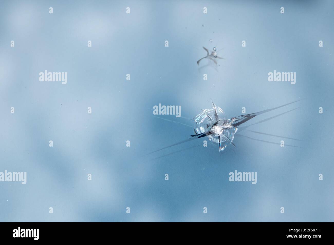 Windshield has cracks from the impact of stone chips while driving ...