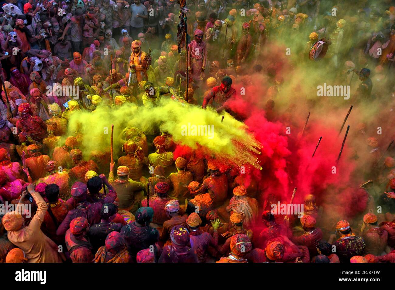 Mathura, India. 24th Mar, 2021. Hindu devotees play with colourful ...