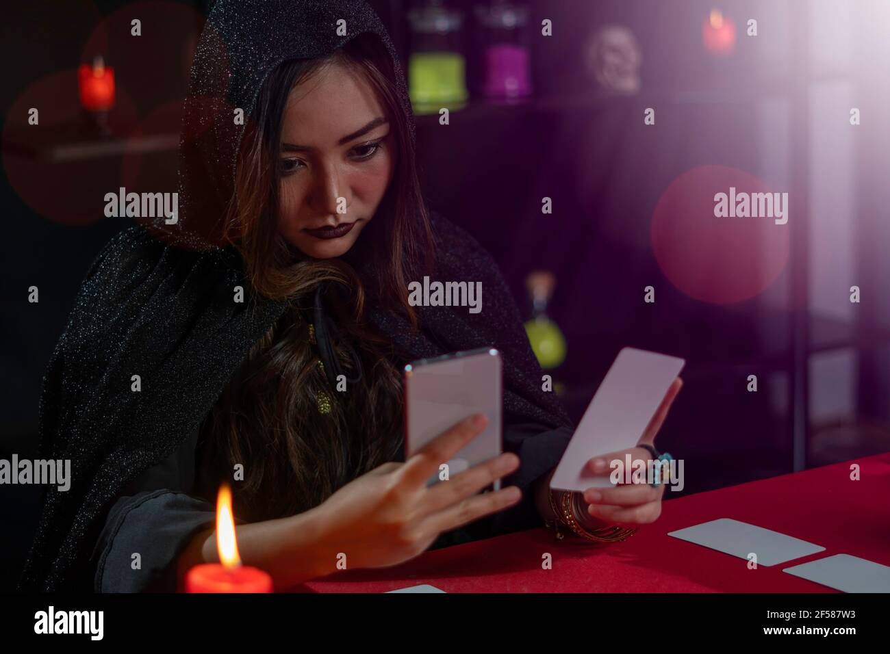 Female fortune teller reads tarot cards for predictions, telling ...