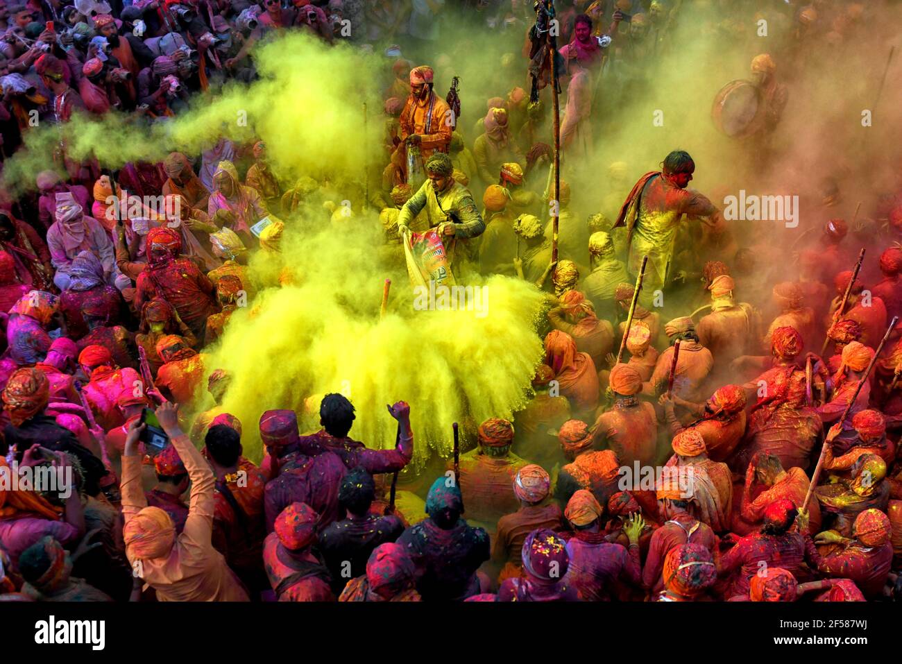 Mathura, India. 24th Mar, 2021. Hindu devotees play with colourful ...