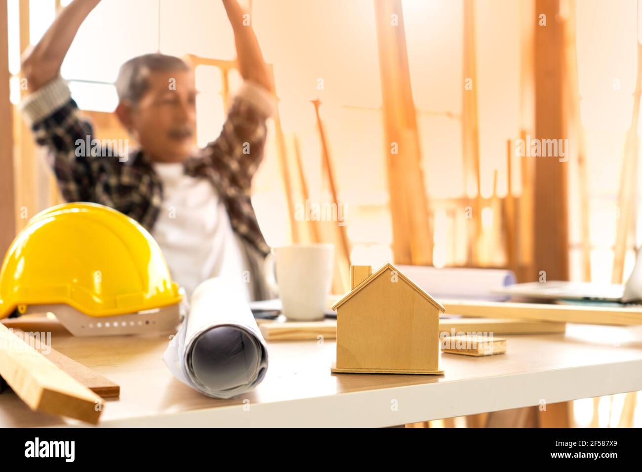 The old man plans to build a wooden house to build a house Stock Photo ...