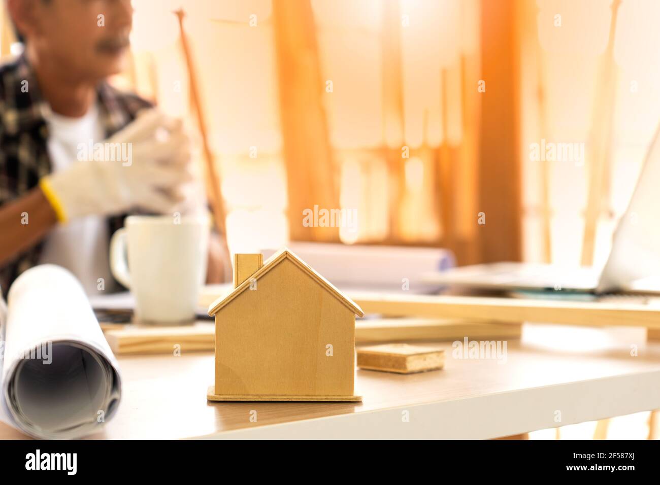 The old man plans to build a wooden house to build a house Stock Photo ...