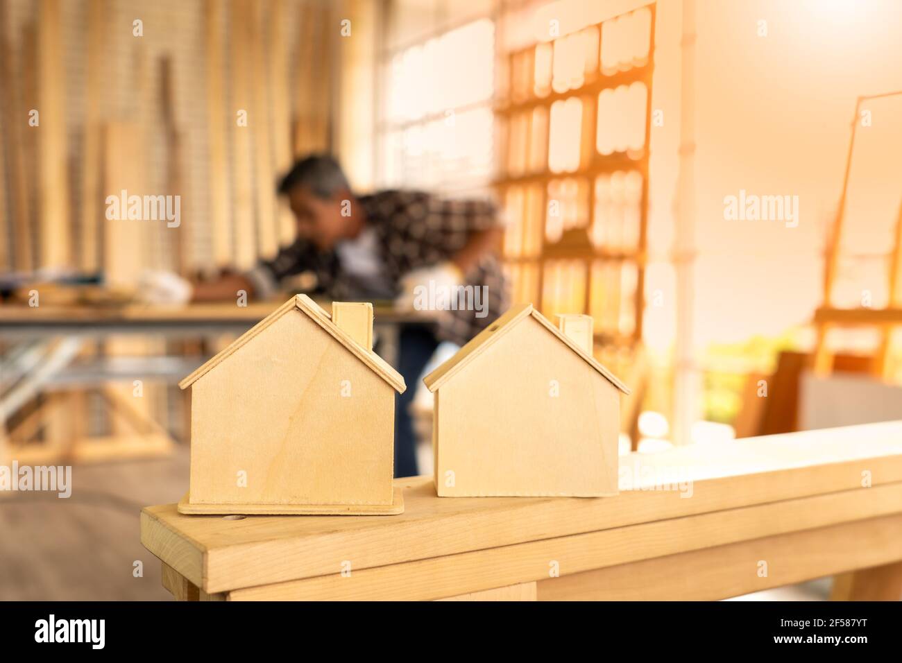 The old man plans to build a wooden house to build a house Stock Photo ...