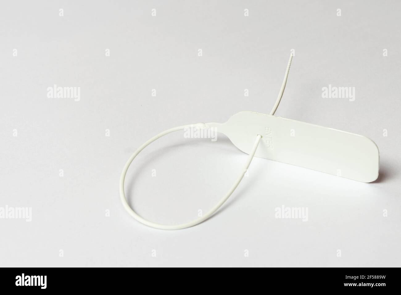 White plastic seal for identification, lock and protection on white ...