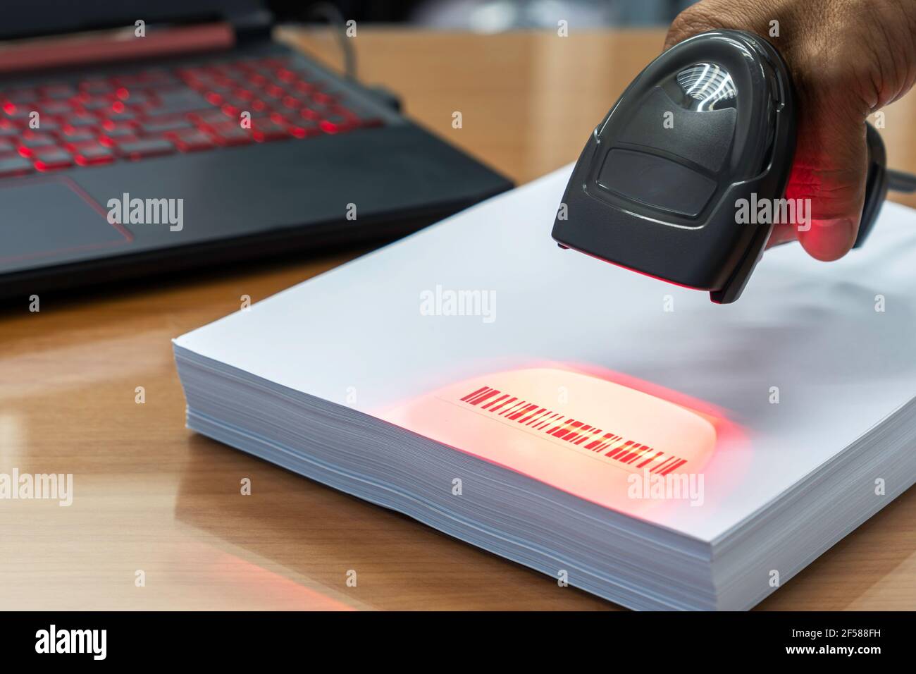 Man hold scanner and scan for reading barcode for transfer data to ...