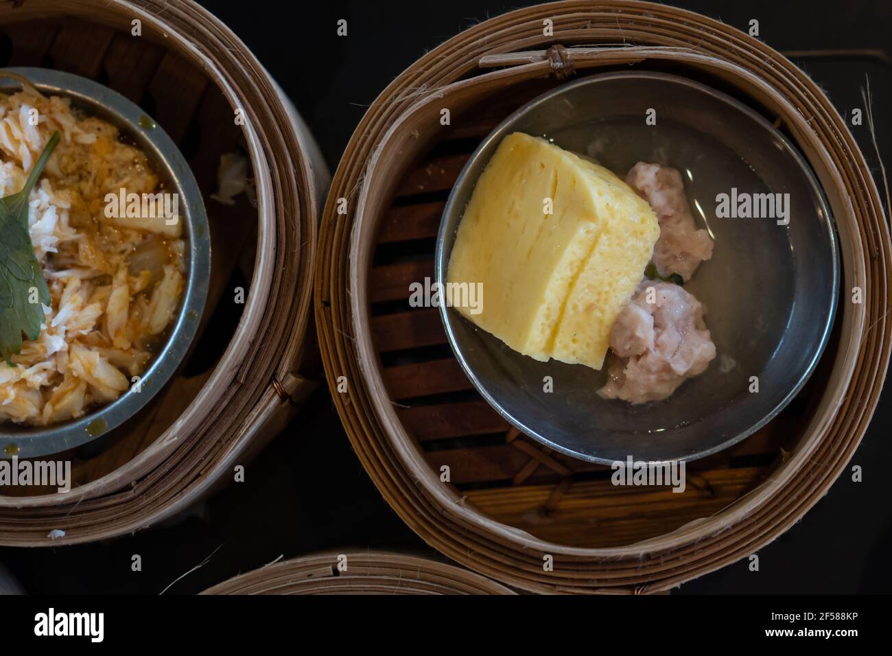 Sweet egg and Dim Sum in bamboo basket Stock Photo - Alamy