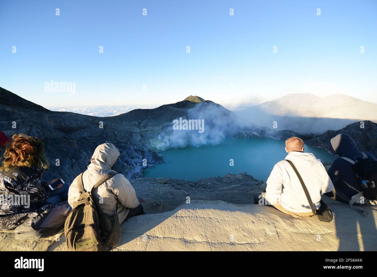 Tourist enjoying the views of the Ijen volcano crater in Eastern Java ...