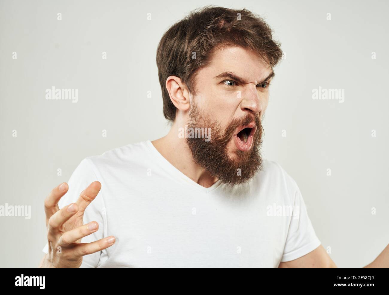 The guy in the T-shirt shows the index finger and emotions model an ...