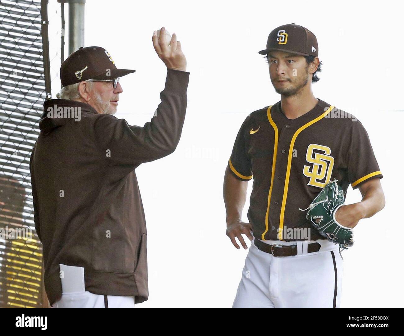 San Diego Padres pitching coach Larry Rothschild (L) and pitcher Yu ...