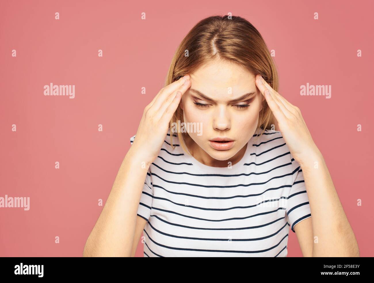Upset woman offended face pink background cropped view model Stock ...
