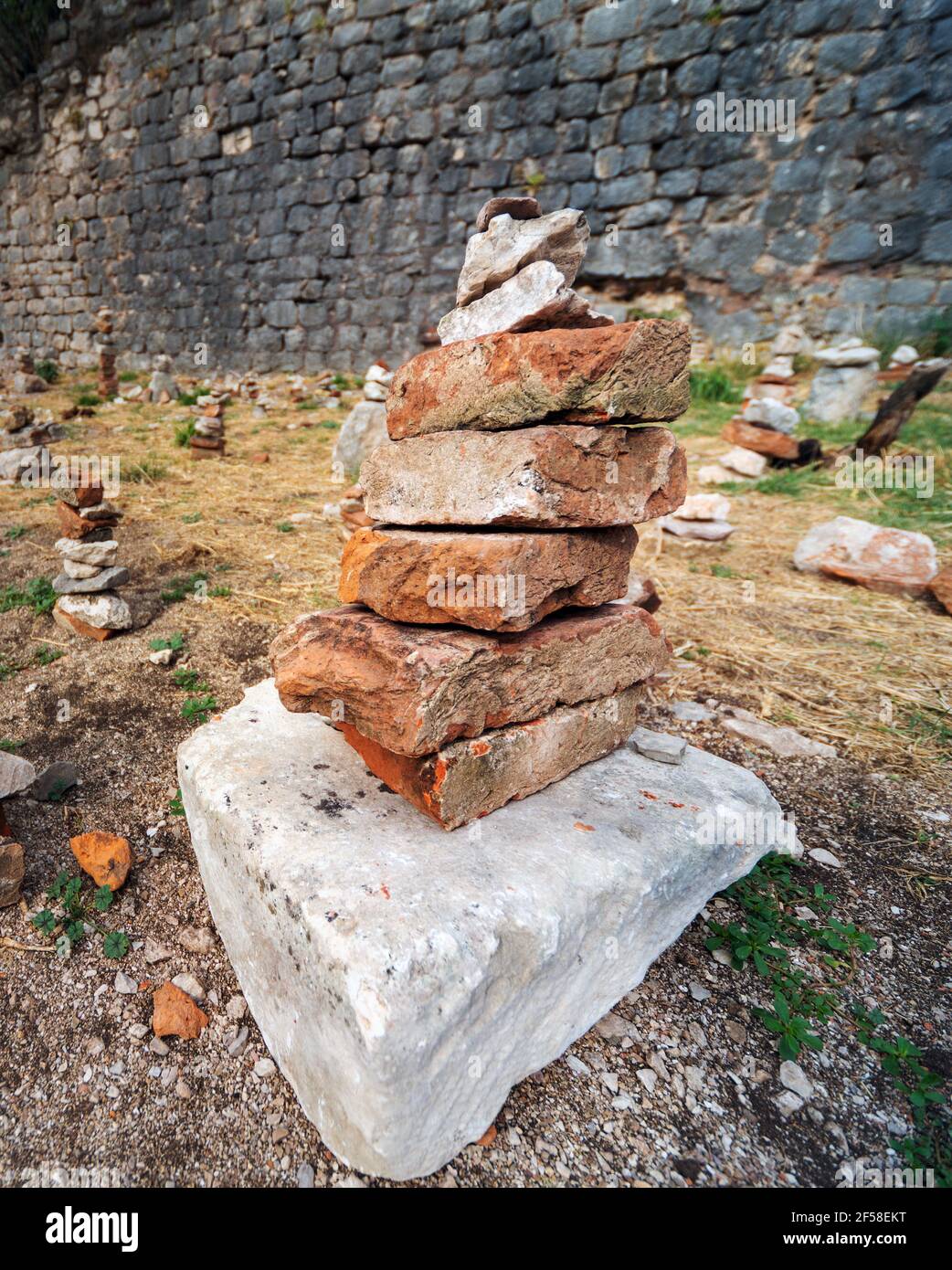 Small stacks os stones carefully stacked and arranged by people,placed ...