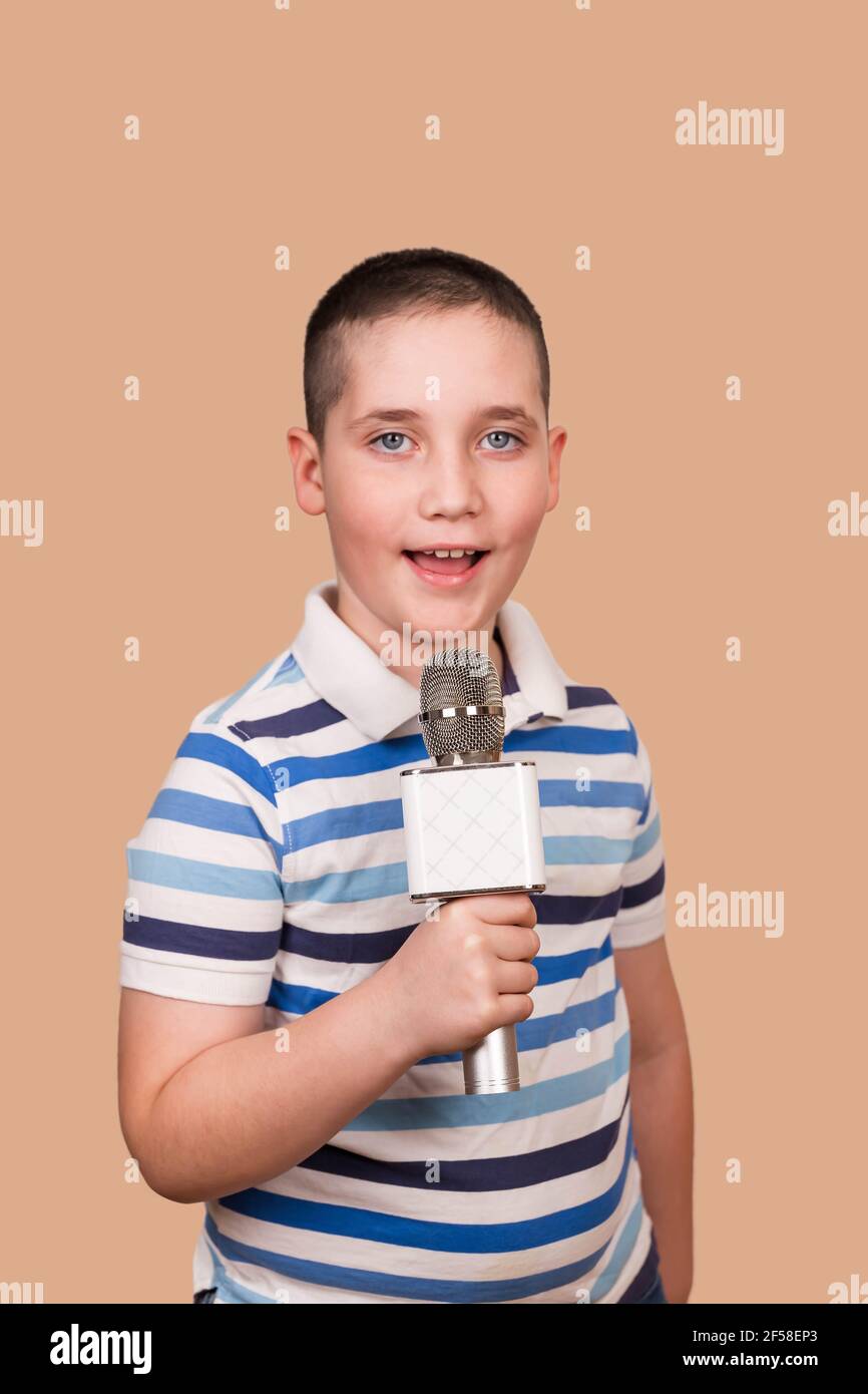 Talented child sings karaoke. Young boy is recording his song Stock ...