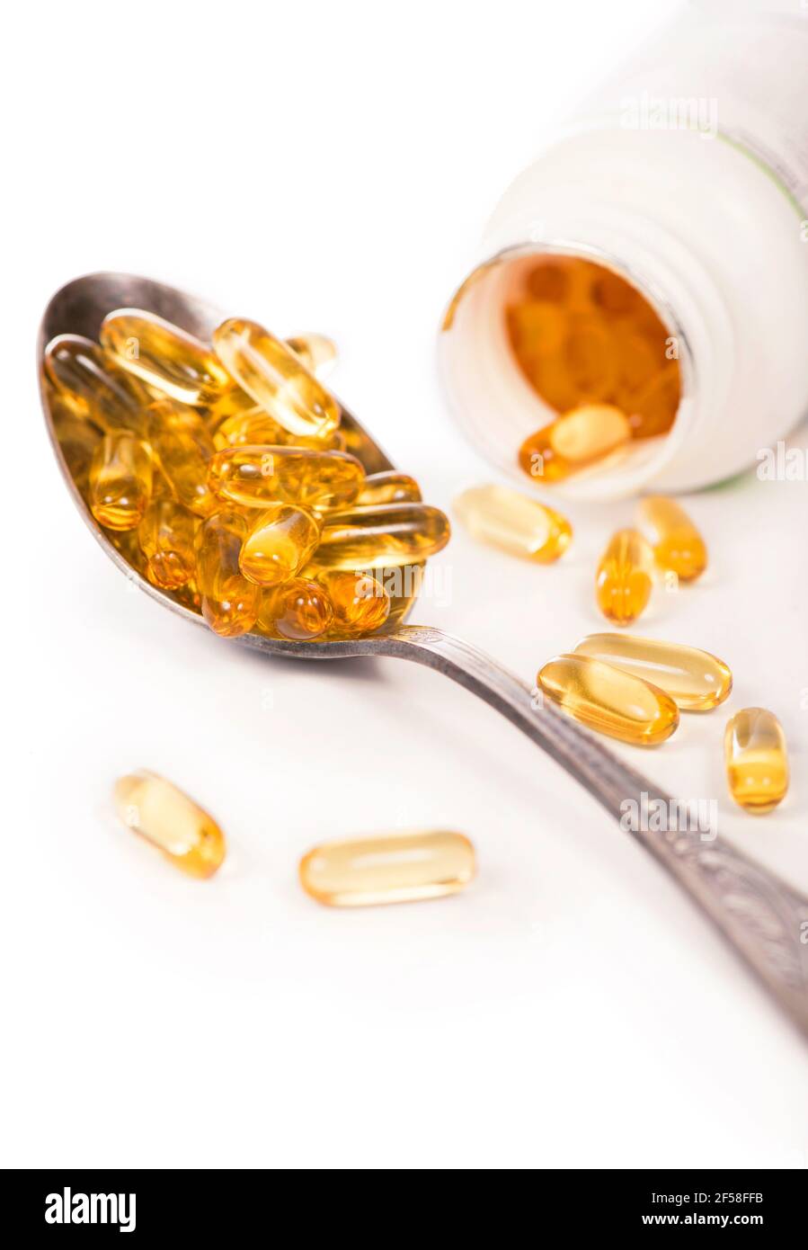 Omega 3 pills ,Fish oil capsules with omega 3 and vitamin D on white ...