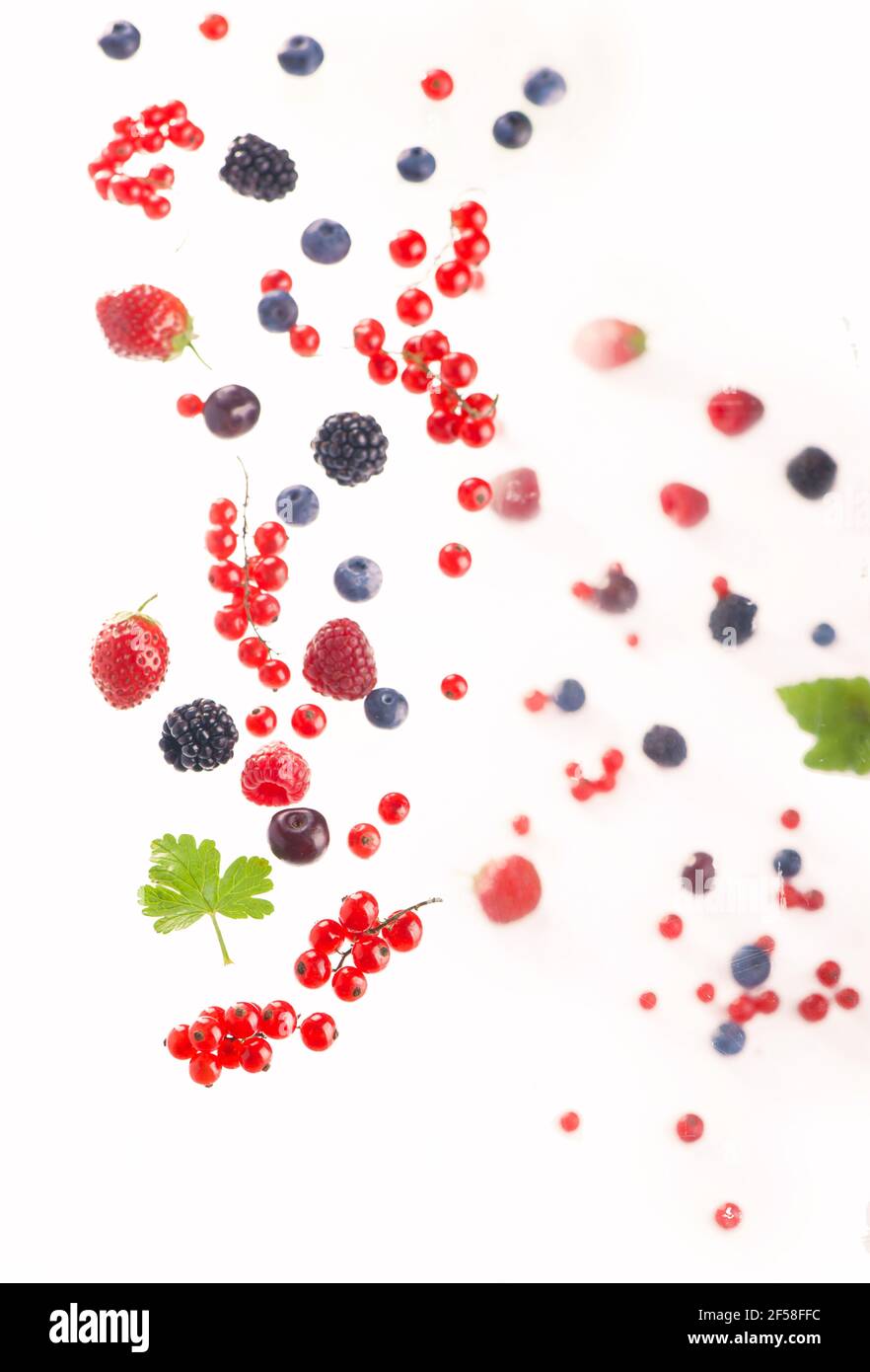 berry mix isolated on a white background Stock Photo - Alamy
