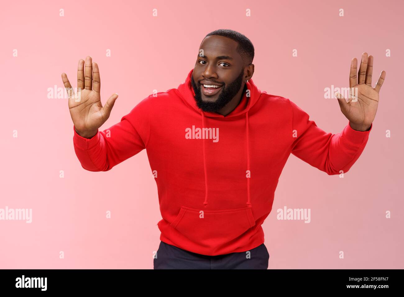 Happy charming outgoing african american male model raise hands joking ...