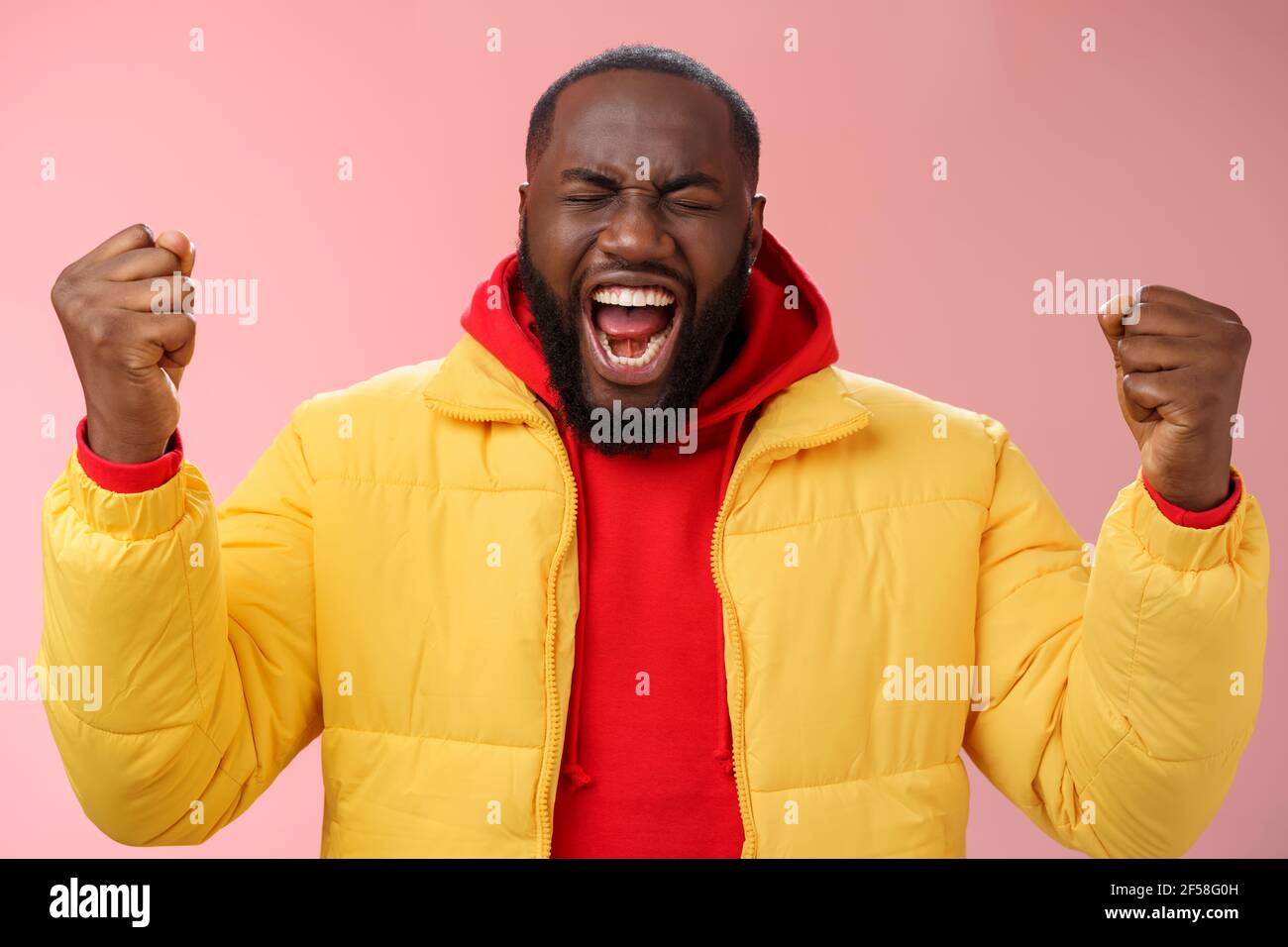 Handsome african-american man encouraging himself put will effort ...