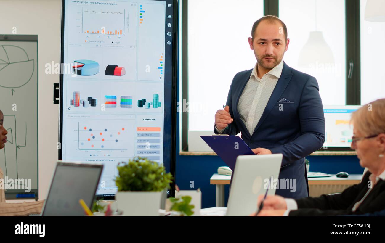 Manager presenting project reports partners hi-res stock photography ...