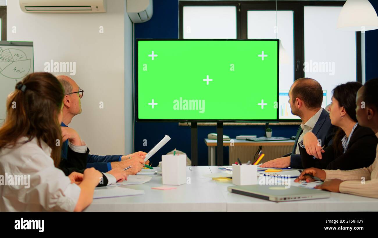Tv green screen mockup ready for presentation placed in front of desk ...