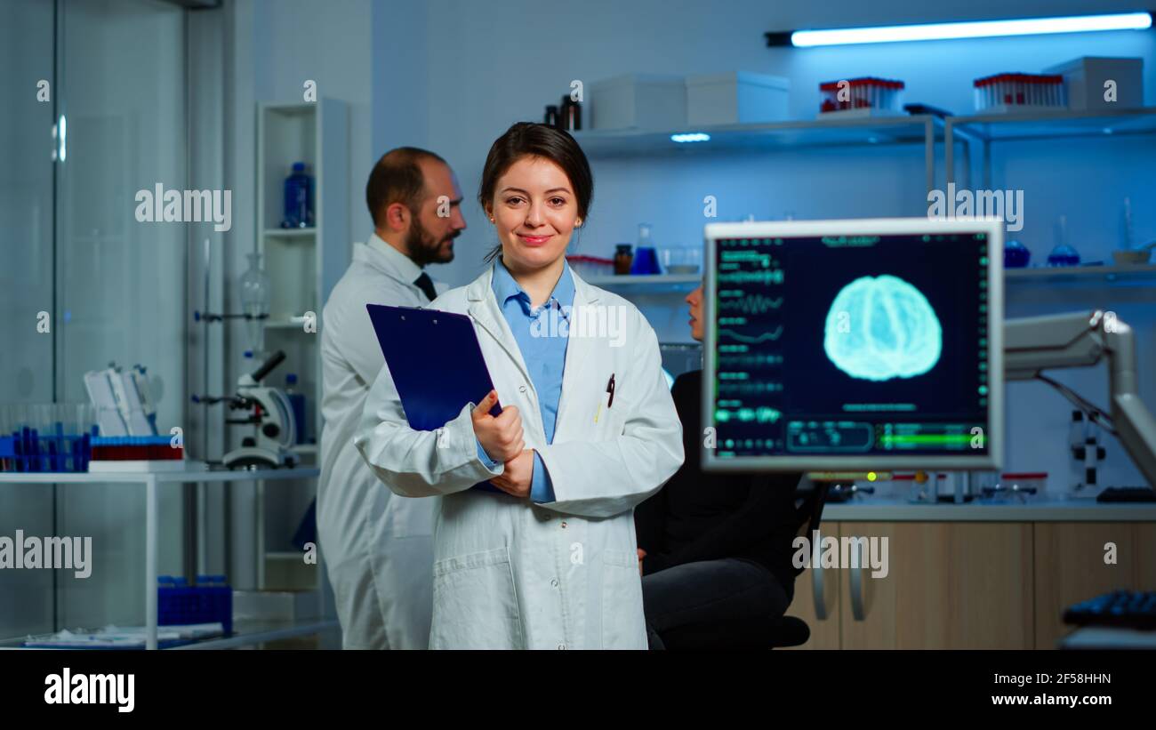 Portrait of scientist neurologist researcher looking at camera smiling ...