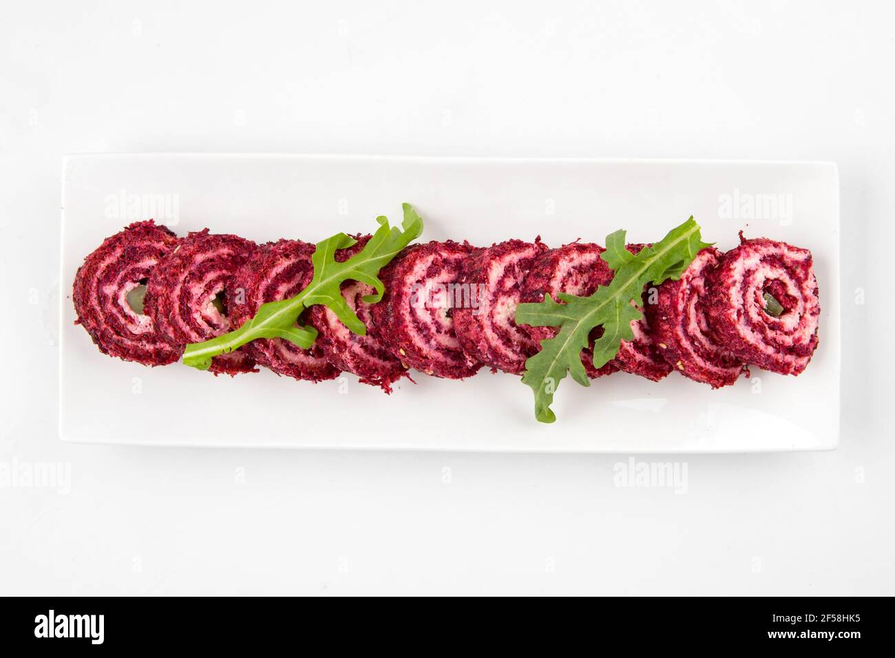Isolated sliced beetroot appetizer roll platter Stock Photo - Alamy