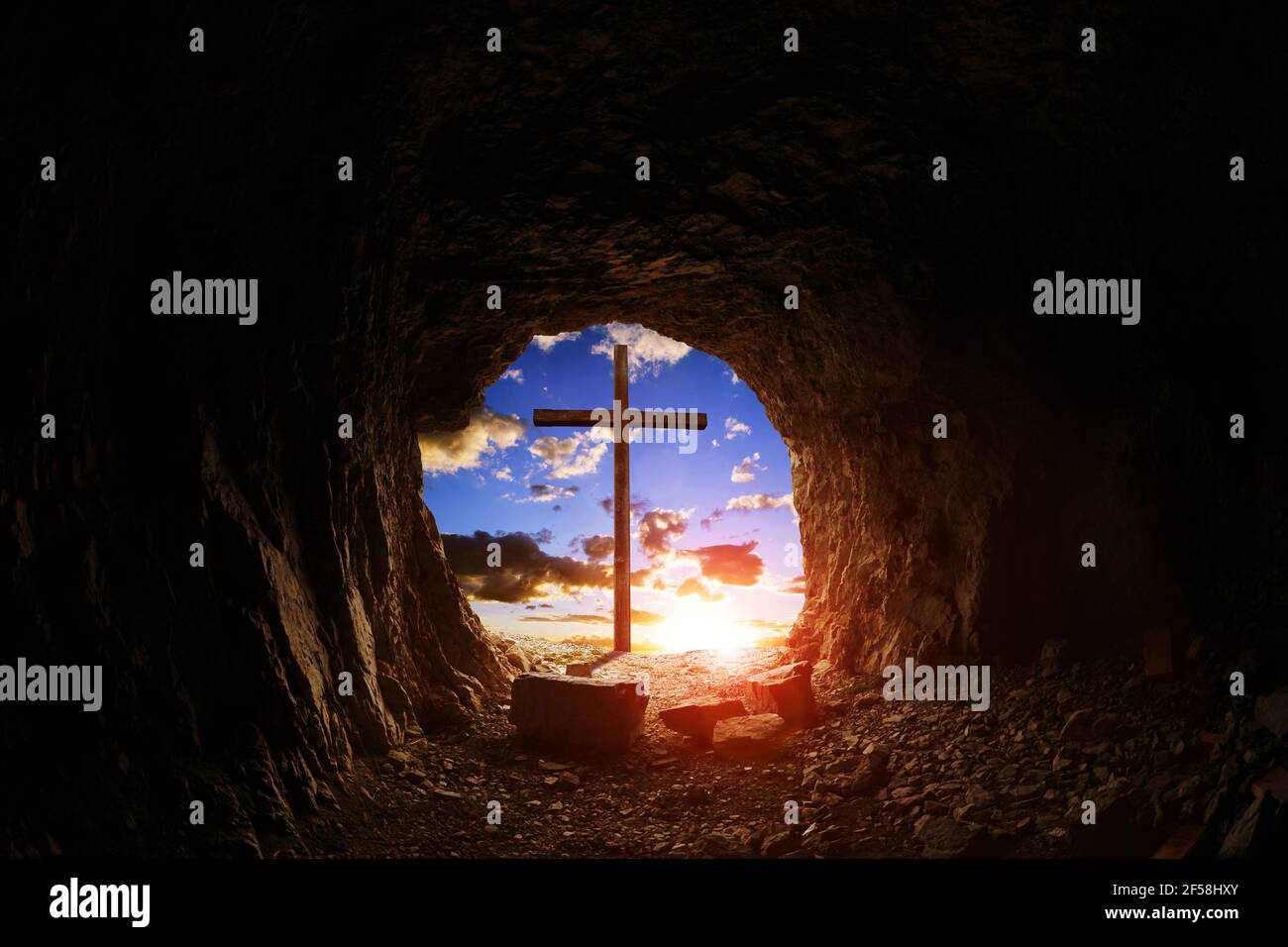 View of wooden cross at sunset from cave Stock Photo - Alamy