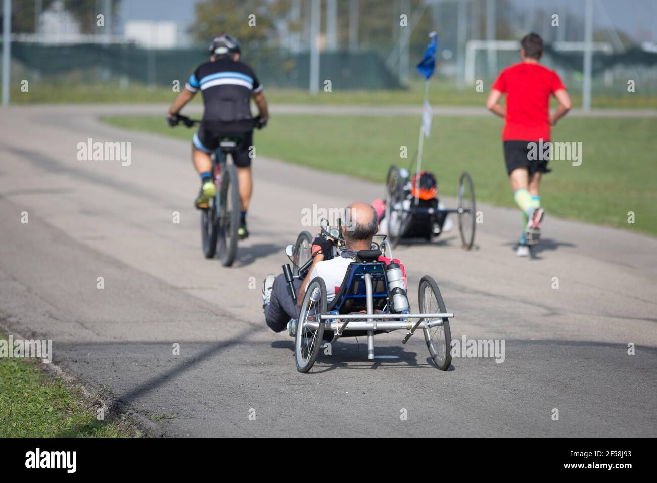 Disabled Athletes training with their Hand Bikes with Cyclist and ...