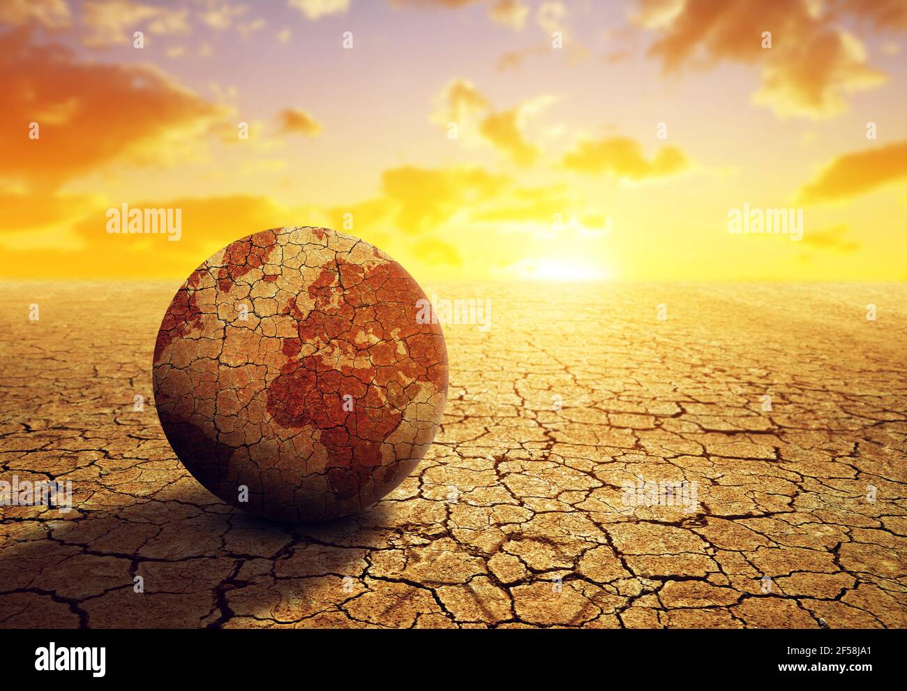Parched planet earth in the dry landscape with cracked soil at sunset ...