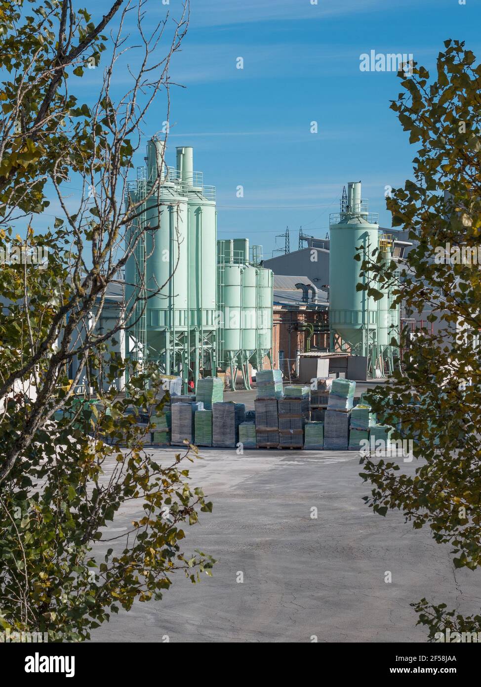 Outdoor Space of a Glass Factory with Vertical Tanks and selected Glass ...