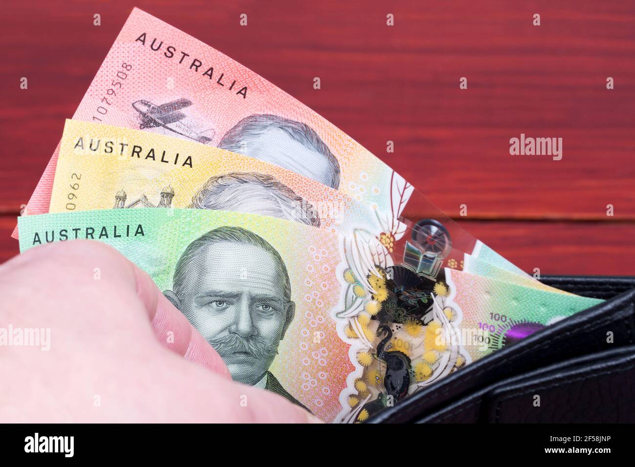 Australian money in the black wallet Stock Photo - Alamy