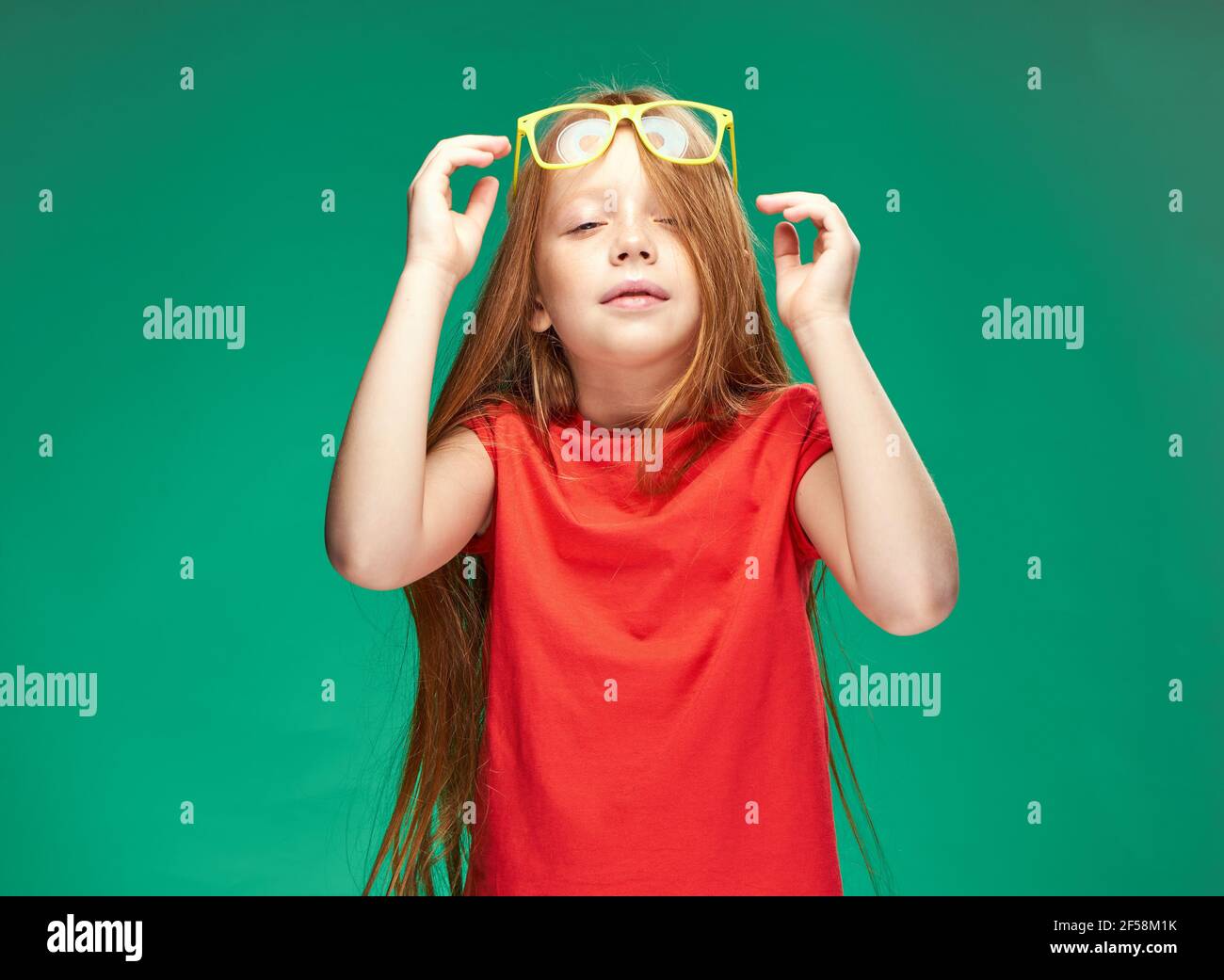 cute red-haired girl with glasses on her head red t-shirt Studio Green ...