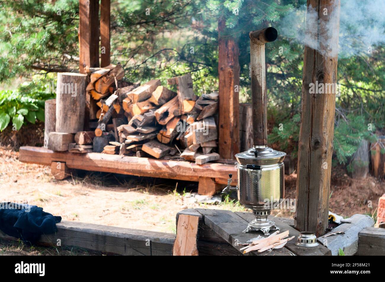 Smoking Russian samovar, metal boiling tank with pipe as chimney for ...