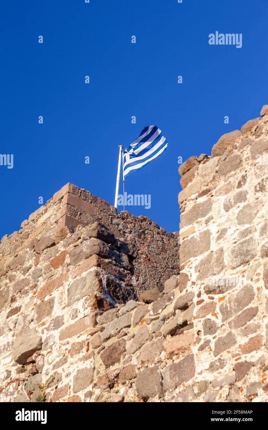 Greek flag waving on the medieval castle of Molivos (or Mithimna), in ...