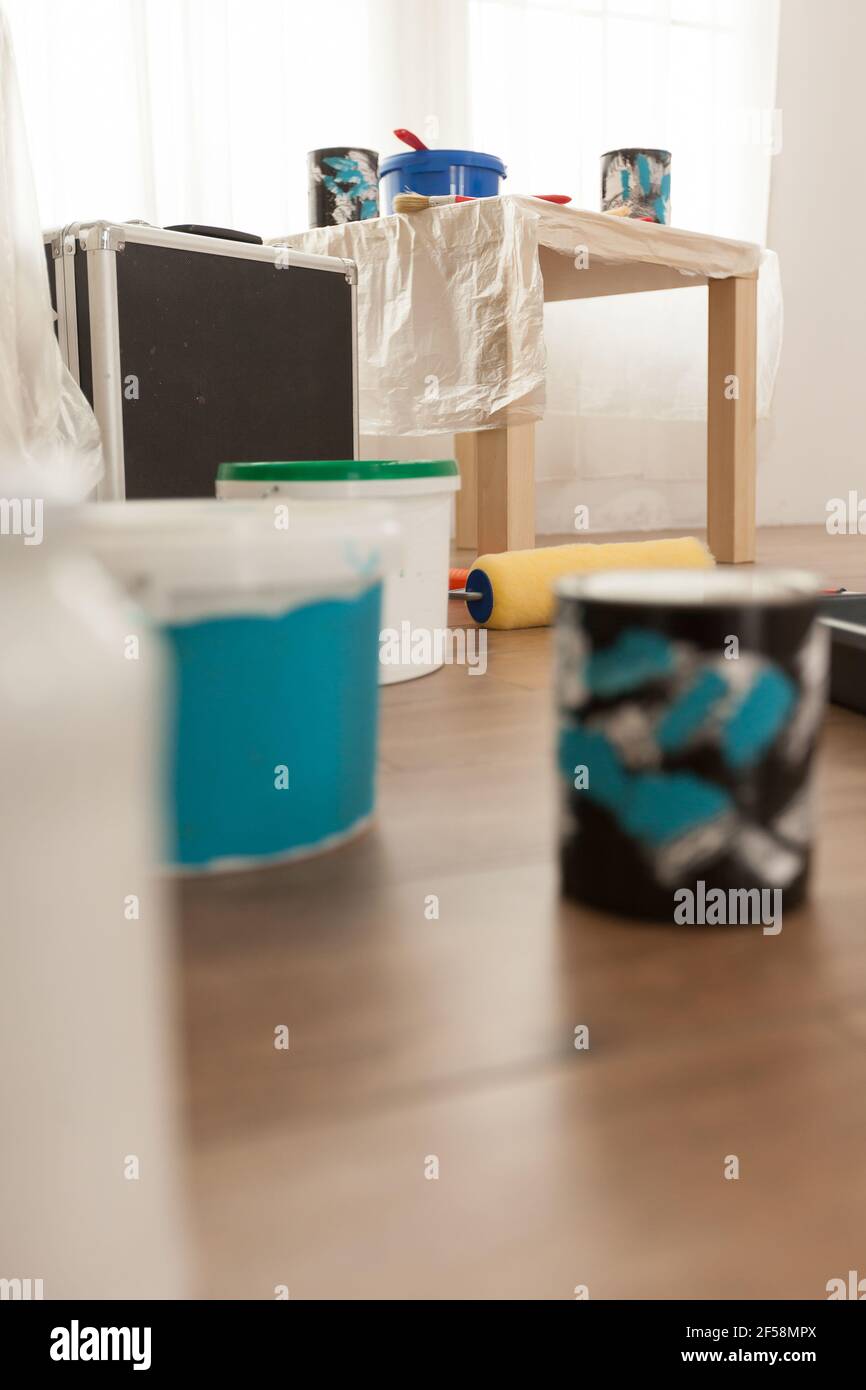 Paint boxes on the floor before decorating the apartment. Home during ...