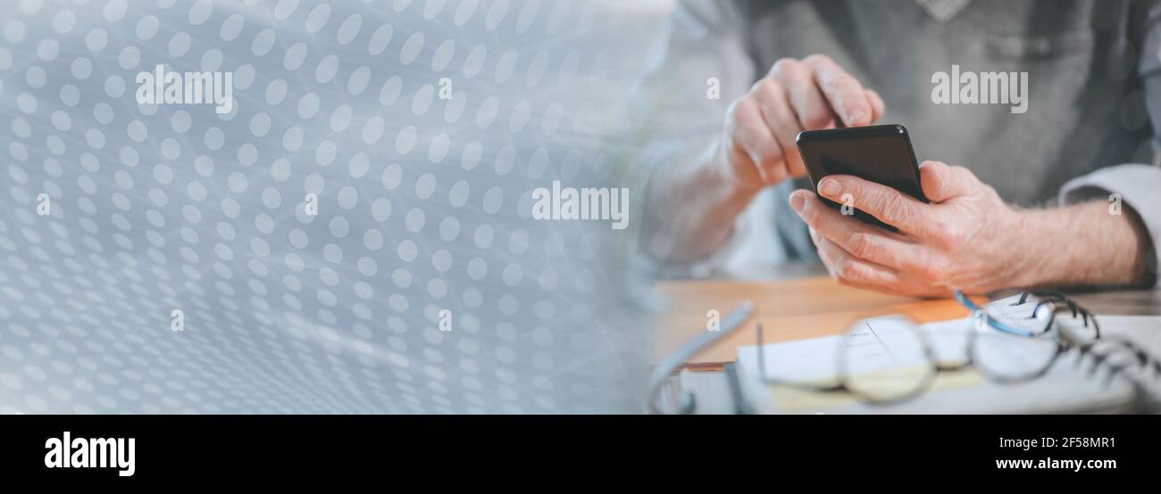 Male hands using mobile phone; panoramic banner Stock Photo - Alamy