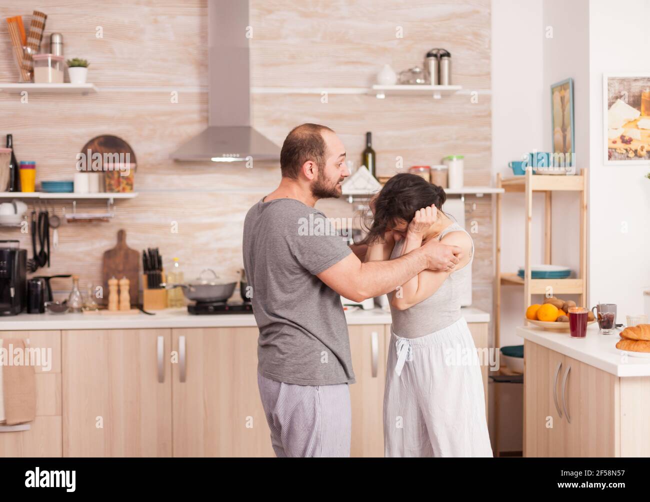 Married couple arguing at the kitchen during breakfast. Domestic ...