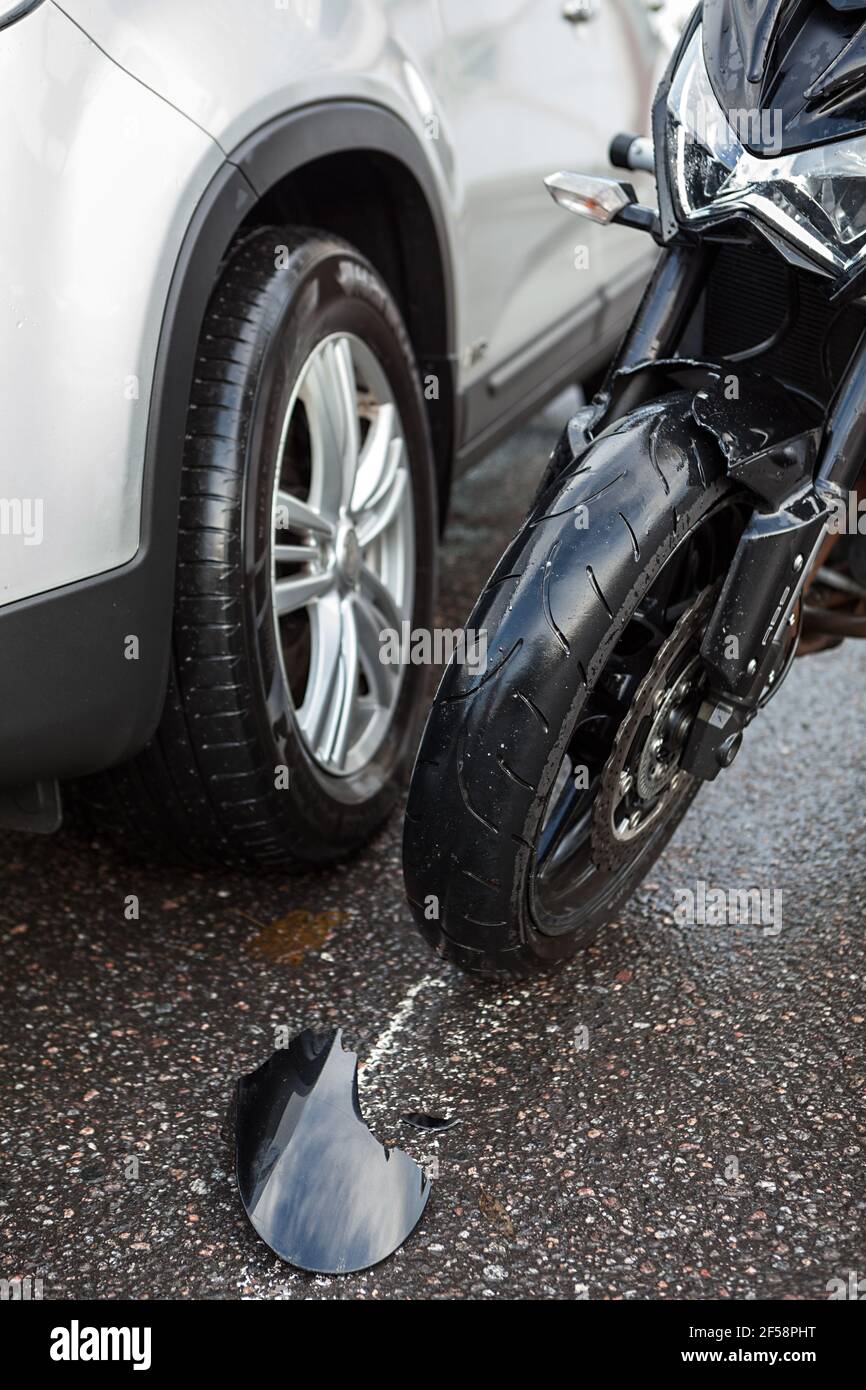 Damaged front plastic fender of motorbike after violently colliding ...