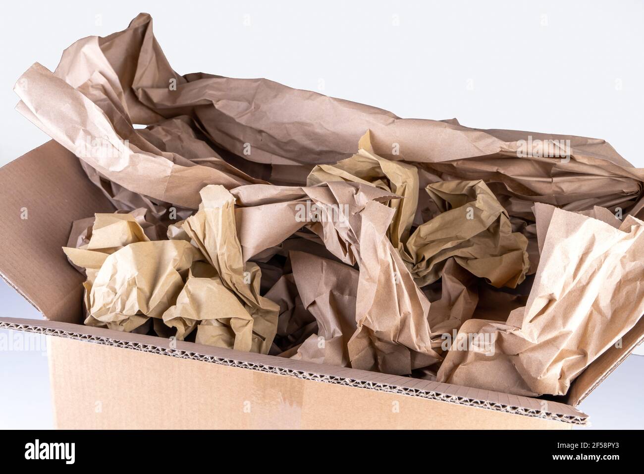 Open cardboard box with paper filling, for safe transport during parcel ...