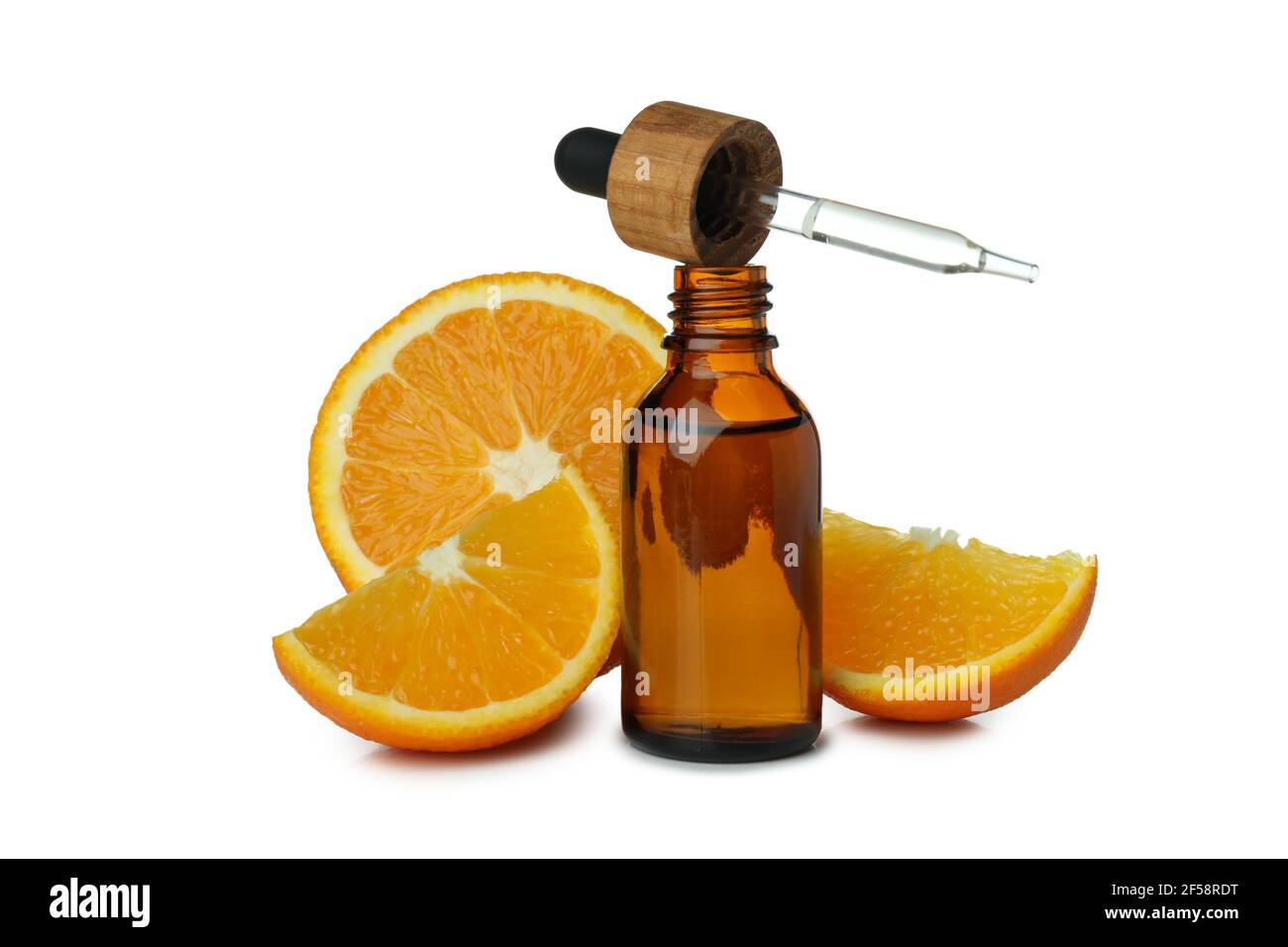 Dropper bottle with oil and orange isolated on white background Stock ...