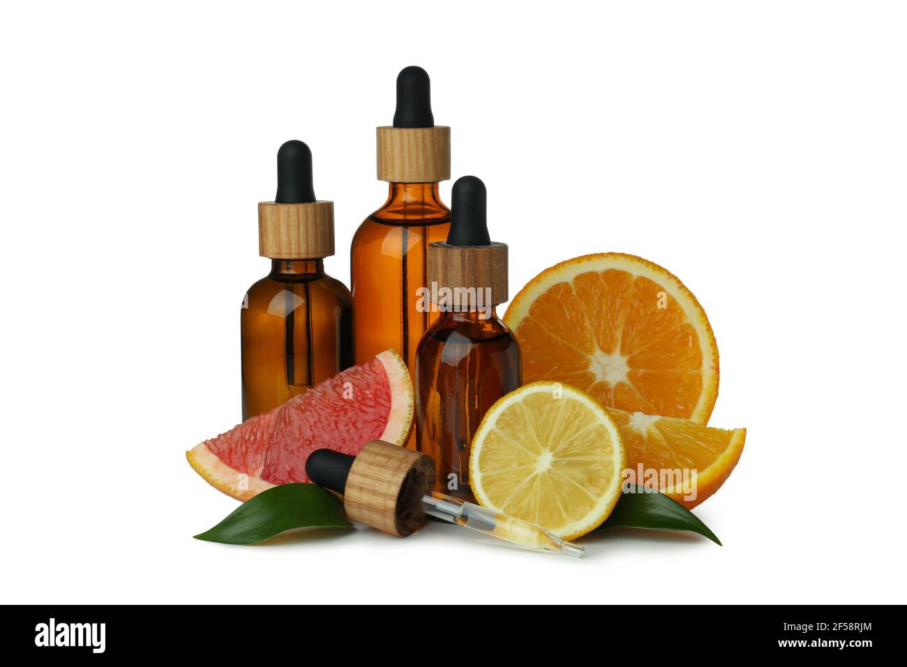 Dropper bottles with oil and citrus isolated on white background Stock ...