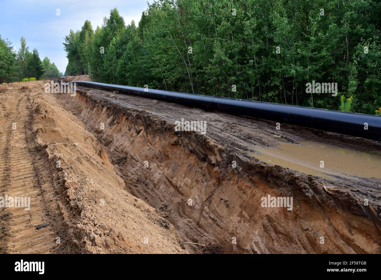 Trench in ground for laying pipeline of natural gas. Building of ...