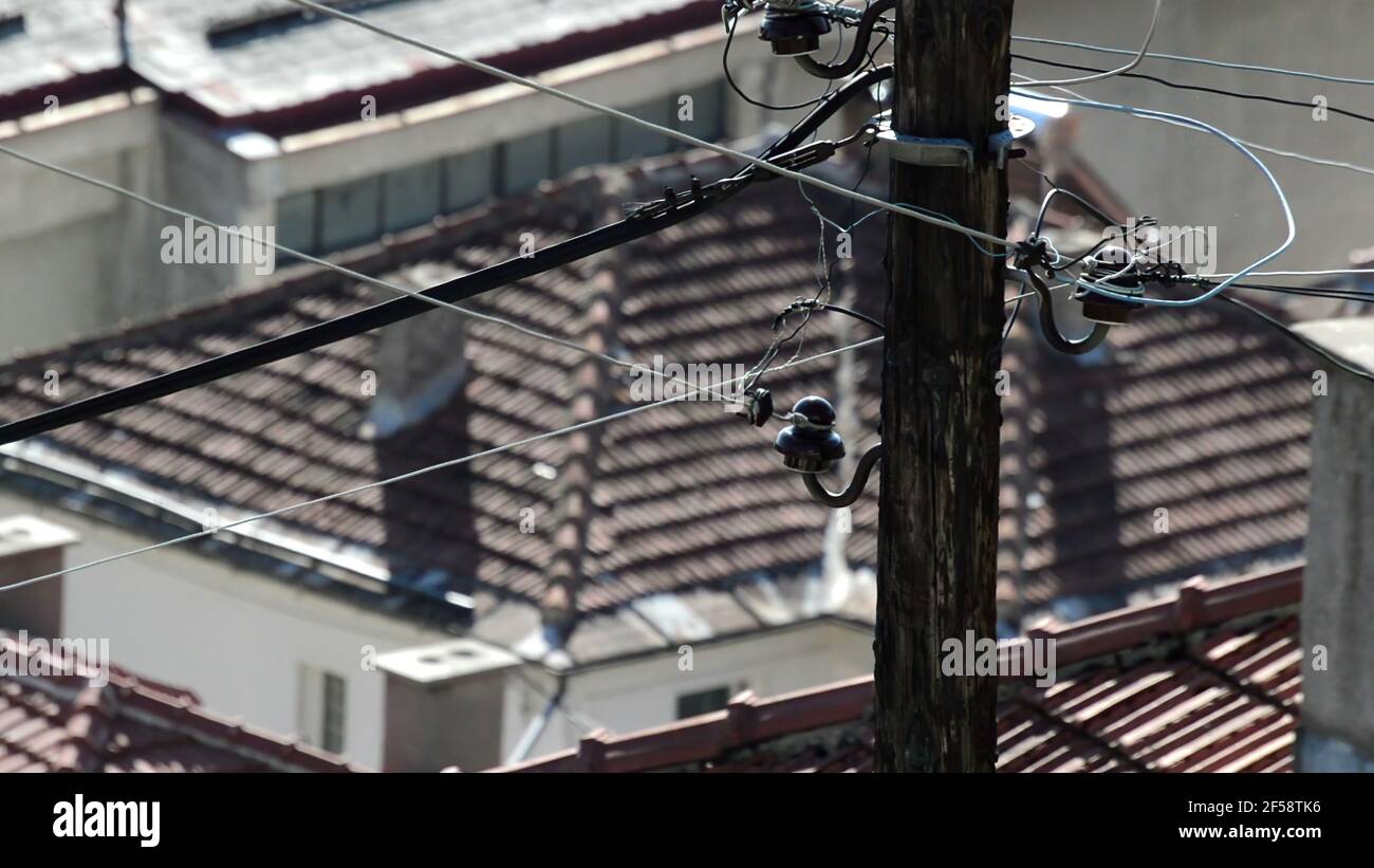 Wooden electric pillar with wires & lamp Stock Photo - Alamy