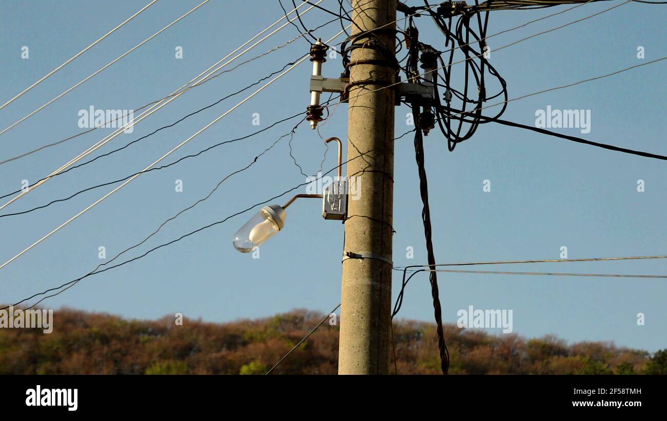 concrete electric pillar with wires & lamp Stock Photo - Alamy