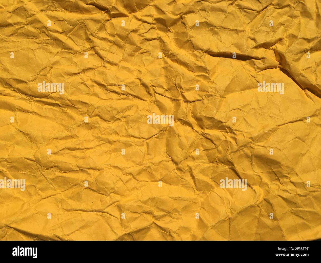 Yellow wrinkled paper background for Design. Copy space for text or ...