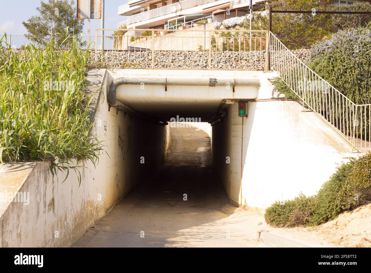 Simple subway for vehicles and pedestrians; crossing under a road and a ...