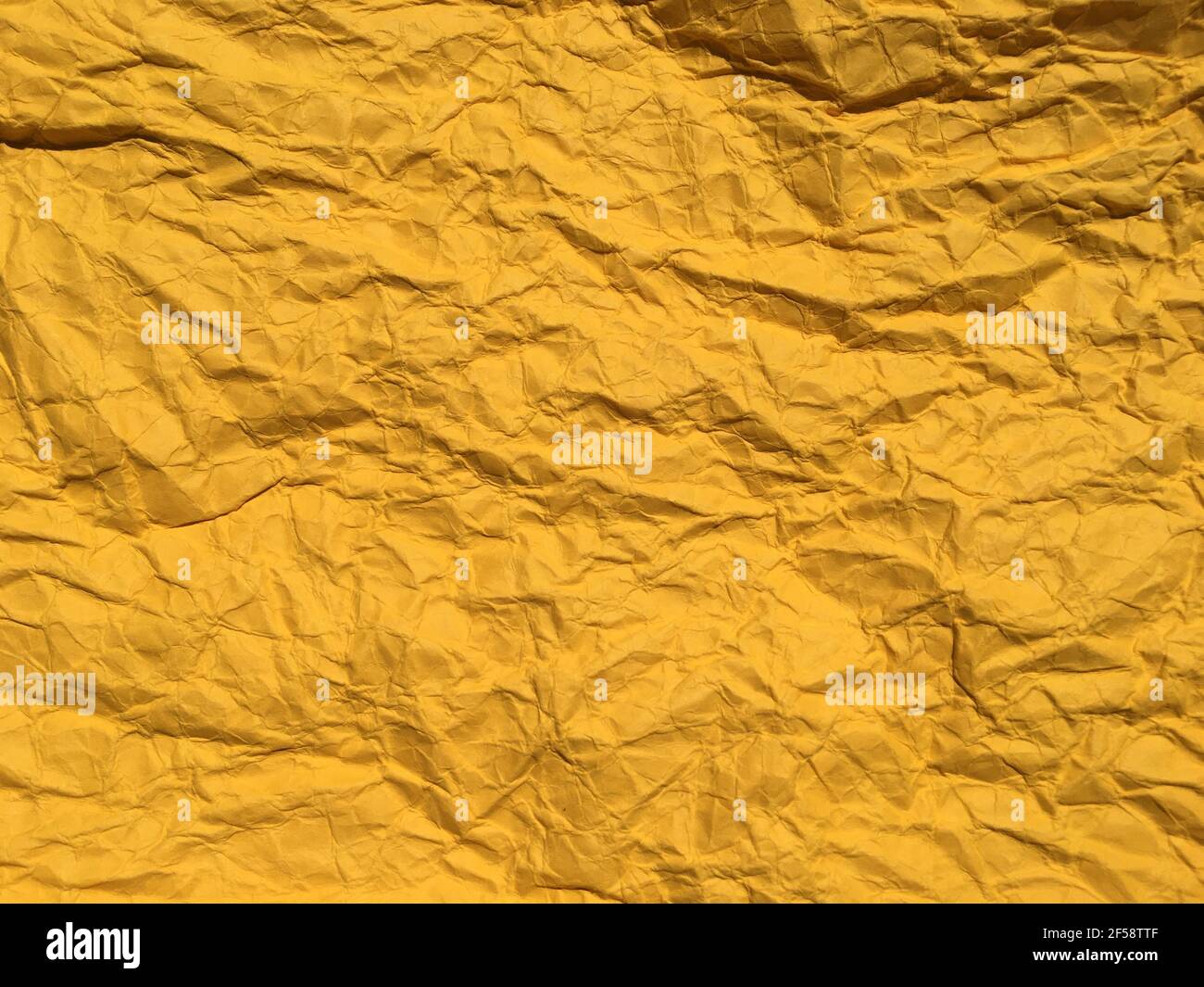 Yellow wrinkled paper background for Design. Copy space for text or ...