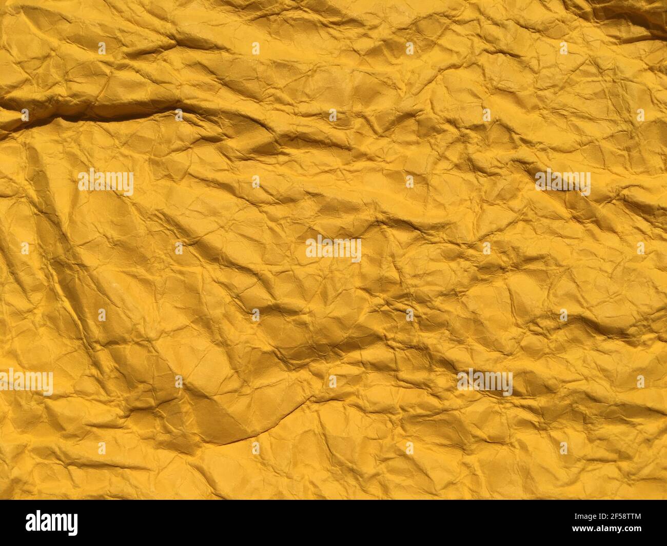 Yellow wrinkled paper background for Design. Copy space for text or ...